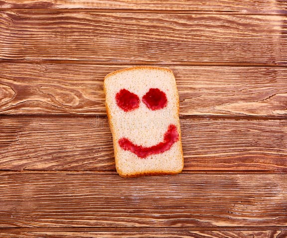 Slice of Bread with a Smile on a Wooden Stock Photo - Image of ...
