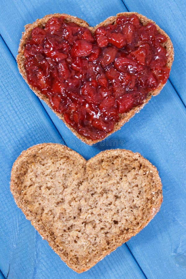 Slice of Bread with Strawberry Jam for Breakfast. Shape of Heart Stock ...