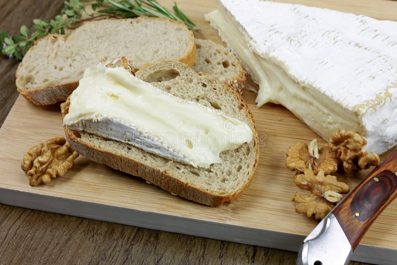 Slice of brie and bread stock photo. Image of gastronomy - 174282310