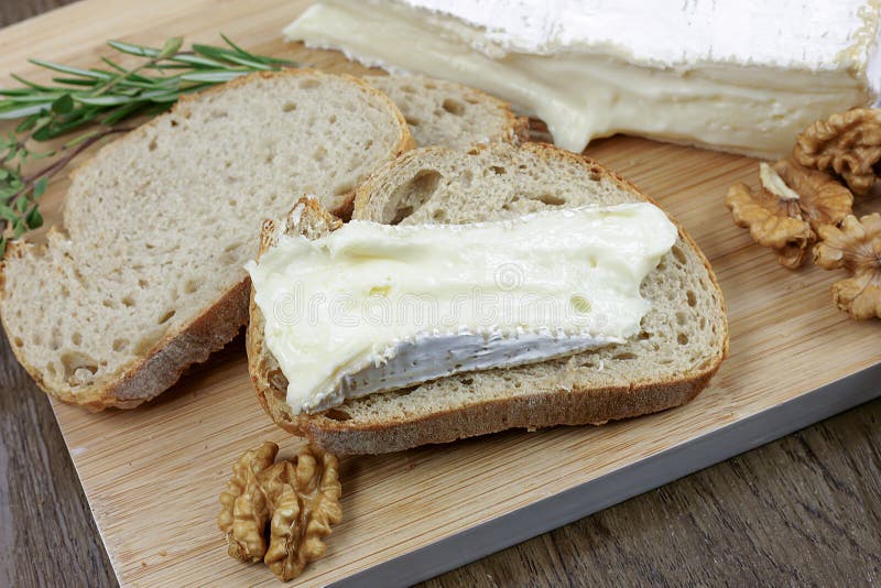 Slice of brie and bread stock image. Image of slice - 174282365
