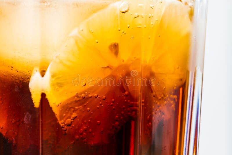 Slice of Citrus Fruit Floating in Glass of Cola Stock Photo - Image of ...