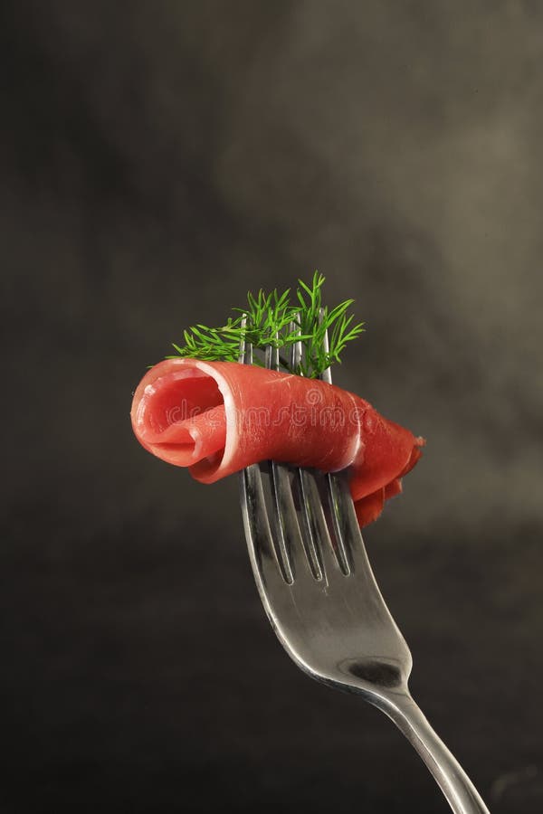 Slice of Dry Ham Rolled on a Fork Stock Image - Image of parma, meat ...