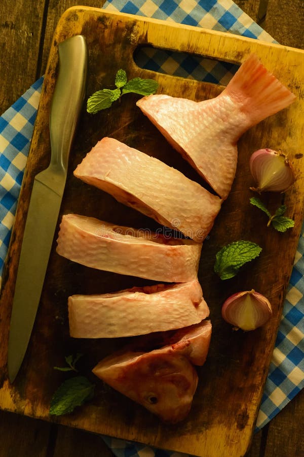 Slice Fish on Chopping Board with Knife and Mint with Shallot. Stock ...