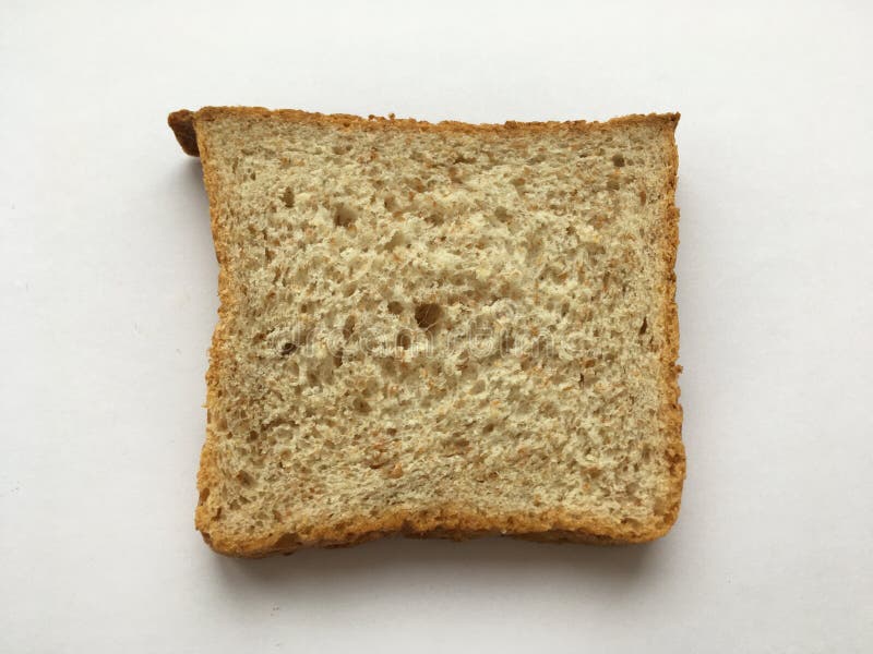 A Slice of Fresh Bran Bread Lying Close Up on a White Background ...