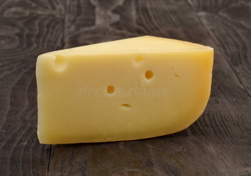Slice of Fresh Cheese on a Black Wooden Table Stock Photo - Image of ...