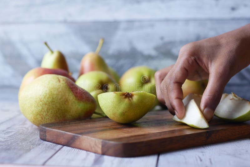 Slice of Fresh Pears on Table Close Up Stock Image - Image of hand ...