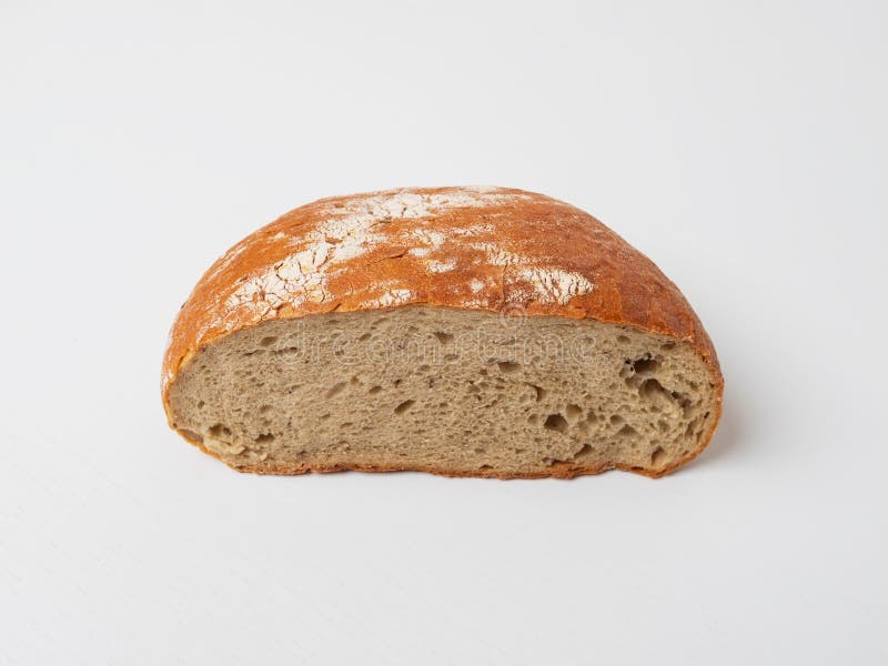 A Slice of Fresh Round Loaf of Bread on a White Table Stock Photo ...