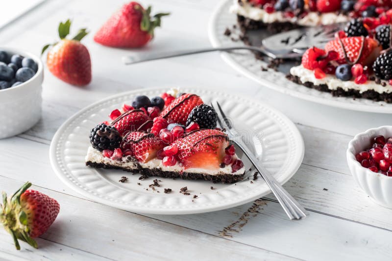 A Slice of Freshly Made Mixed Berry Cheesecake with a Chocolate Cookie ...