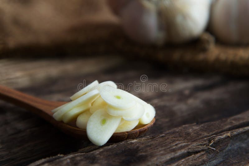 Slice Garlic on Wooden Spoon Stock Image - Image of smell, spoon: 85063621
