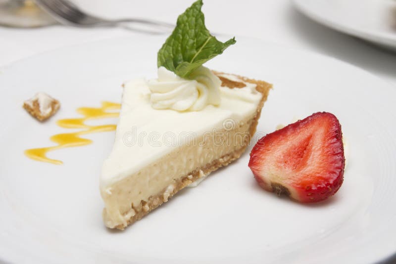 Slice of Key Lime Pie and a Strawberry Stock Photo - Image of sauce ...
