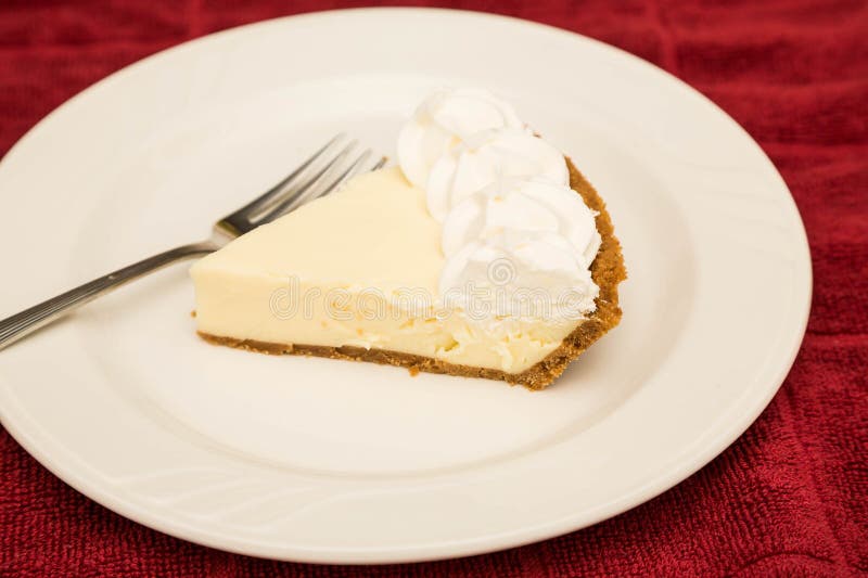 Slice of Key Lime Pie on White Plate and Red Towel Stock Image - Image ...