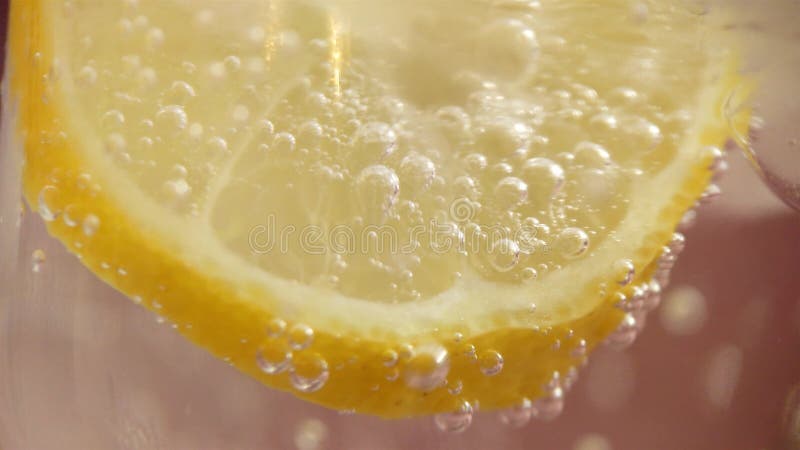 A Slice of Lemon in a Glass with a Carbonated Drink Stock Footage ...