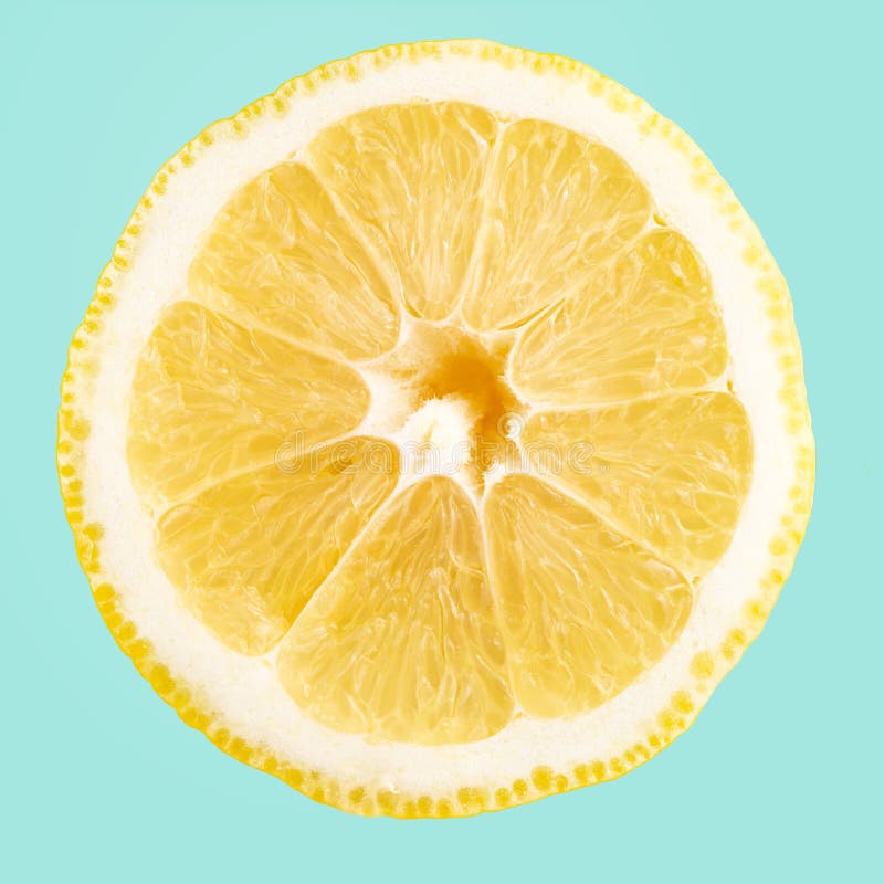 A Slice of Lemon Isolated on Blue Background Stock Image - Image of ...