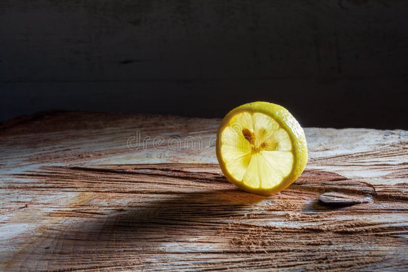 Slice of lemon on wood stock image. Image of lemon, rough - 72060829