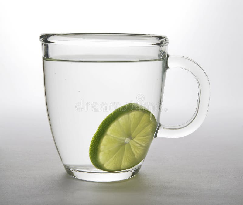 Slice of lime in Glass Mug stock photo. Image of detox - 10996924