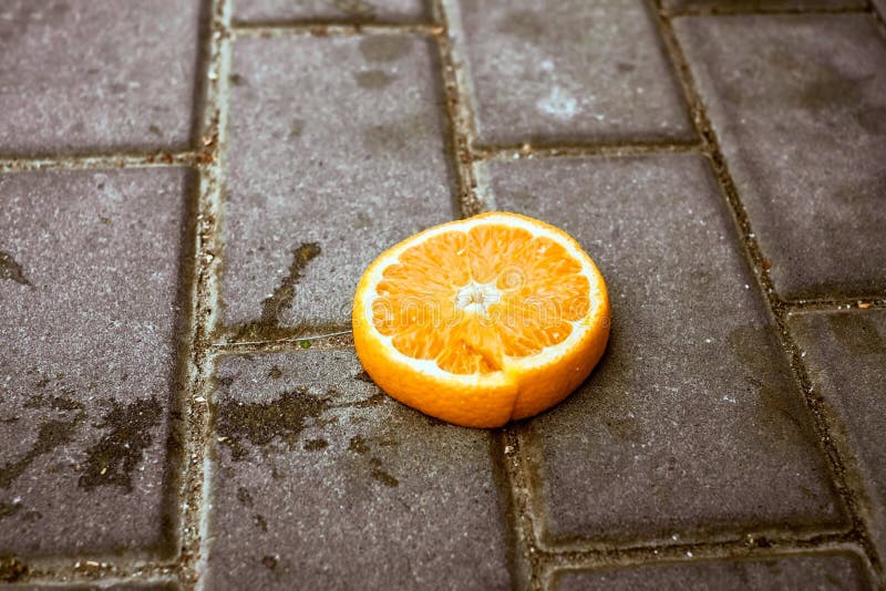 A Slice of Orange on the Sidewalk Stock Photo - Image of architecture ...