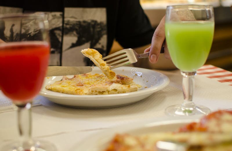 A Slice of Pizza and Juice are on the Table Stock Image - Image of ...