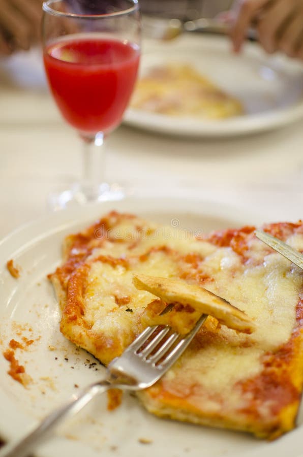 A Slice of Pizza and Juice are on the Table Stock Image - Image of ...