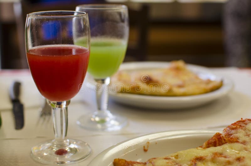 A Slice of Pizza and Juice are on the Table Stock Image - Image of ...