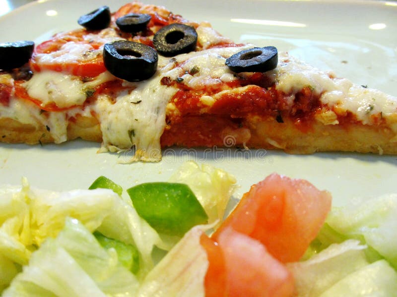 Slice of Pizza and Side Salad Stock Image - Image of serving, dinner ...