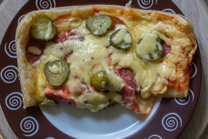 Slice of Rectangular Shaped Home Made Pizza on Plate Stock Photo ...