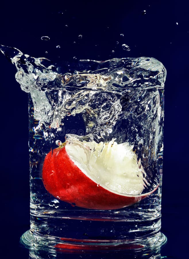 Slice of Red Apple Falling Down in Water Stock Photo - Image of ...