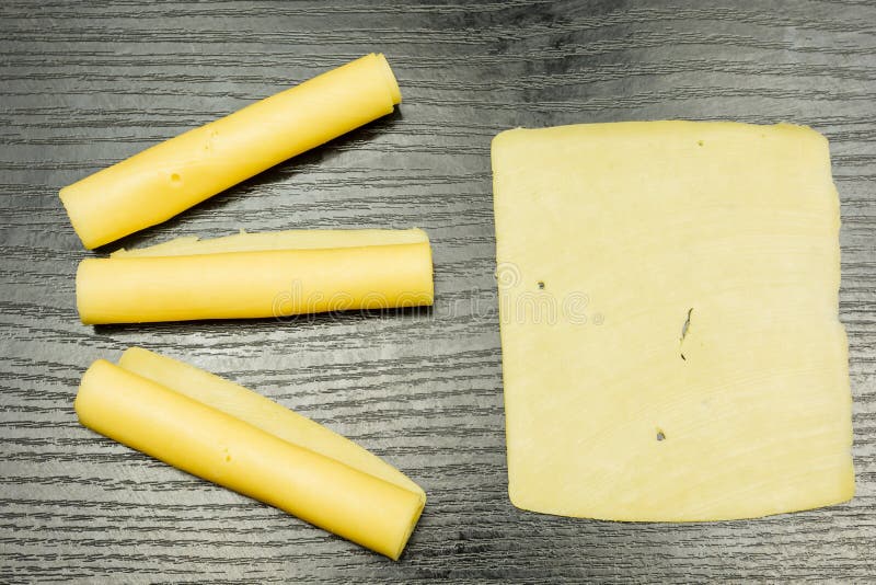 Slice and Rolls of Yellow Cheese. Stock Image - Image of healthy ...