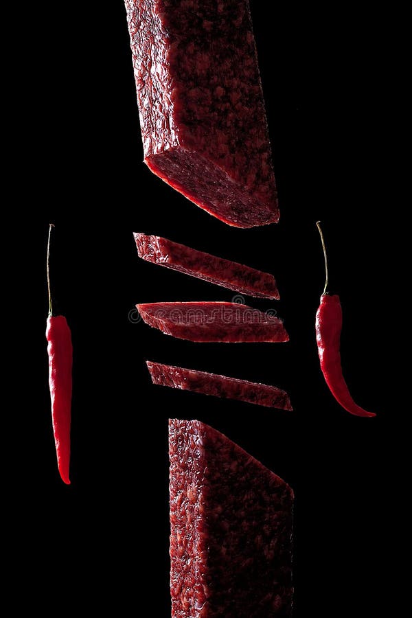 Slice of Salami and Red Pepper on Black Background Stock Photo - Image ...