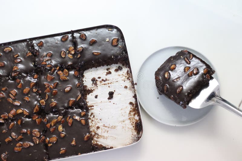 Slice of Texas Sheet Cake Served on a Plate. Buttery and Chocolaty Cake ...