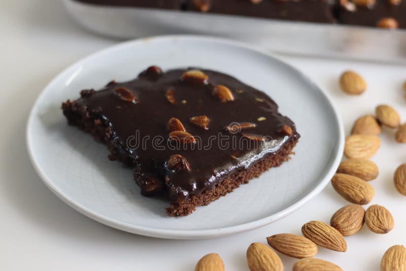 Slice of Texas Sheet Cake Served on a Plate. Buttery and Chocolaty Cake ...