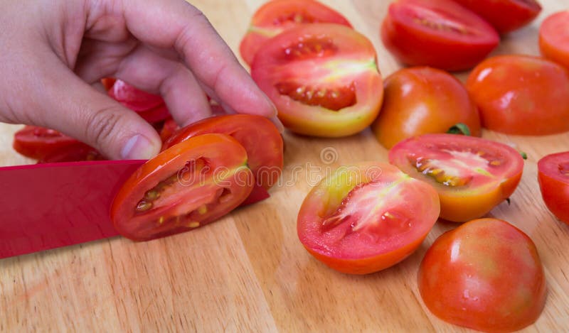 Slice Tomatoes stock image. Image of close, hand, macro - 39444807