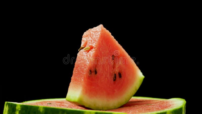 A Slice of Watermelon Spinning on a Black Background Stock Video ...