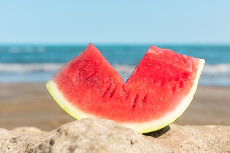 Slice of Watermelon on a Summer Beach Stock Photo - Image of fruit ...