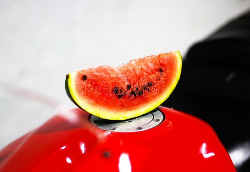 A Slice of Watermelon is on the Tank of the Motorcycle Stock Image ...