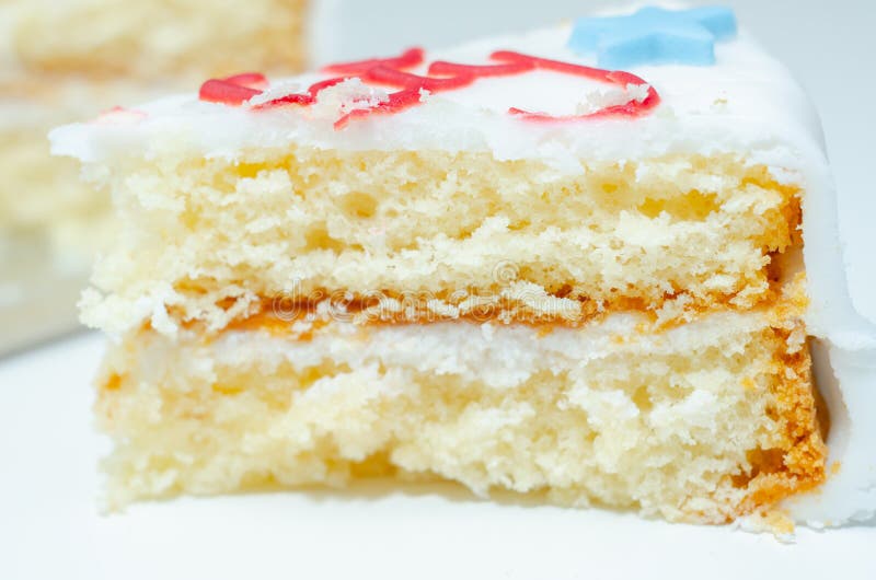 A Slice of White Cake with Color Frosting on Top Stock Photo - Image of ...