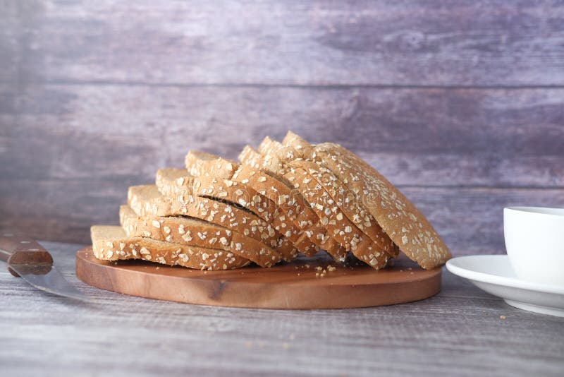 Slice of Whole Grain Bread on Chopping Board Stock Image - Image of ...