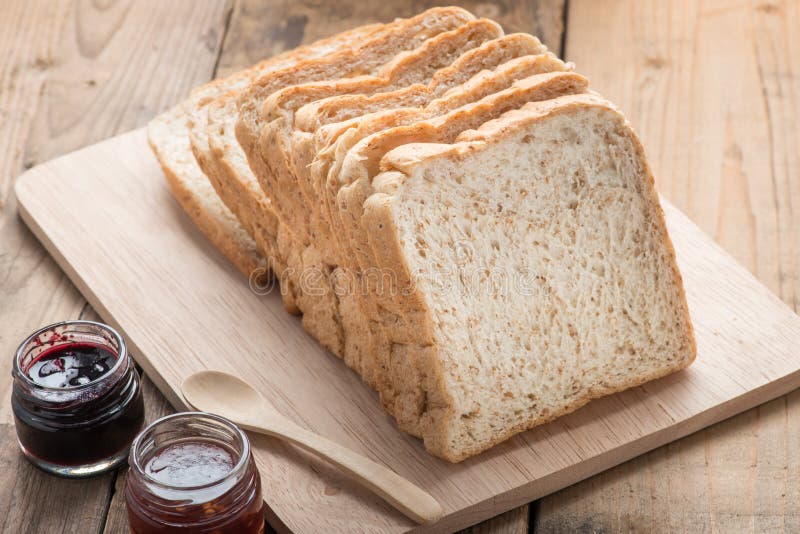 Slice of a Whole Wheat Bread with Samll Jam Jar. Stock Image - Image of ...