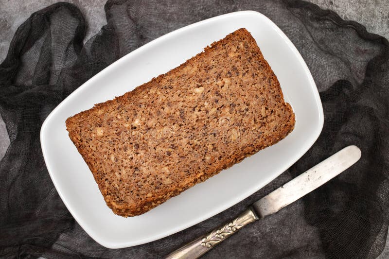 Slice of Wholemeal Dark Bread with Seeds on Dish Stock Photo - Image of ...