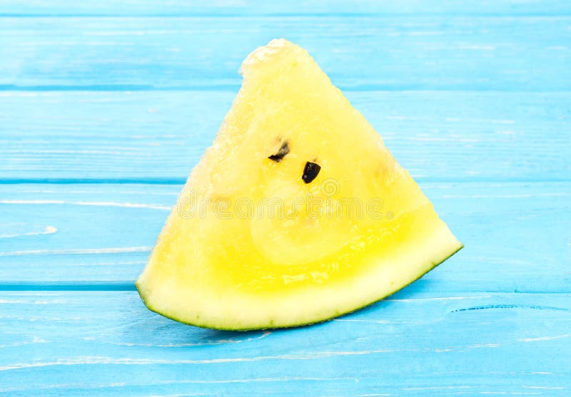 Slice yellow watermelon stock image. Image of drink, black - 76010315