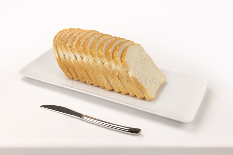 Sliced â€‹â€‹bread on Rectangular Dish and a Knife Stock Photo - Image ...