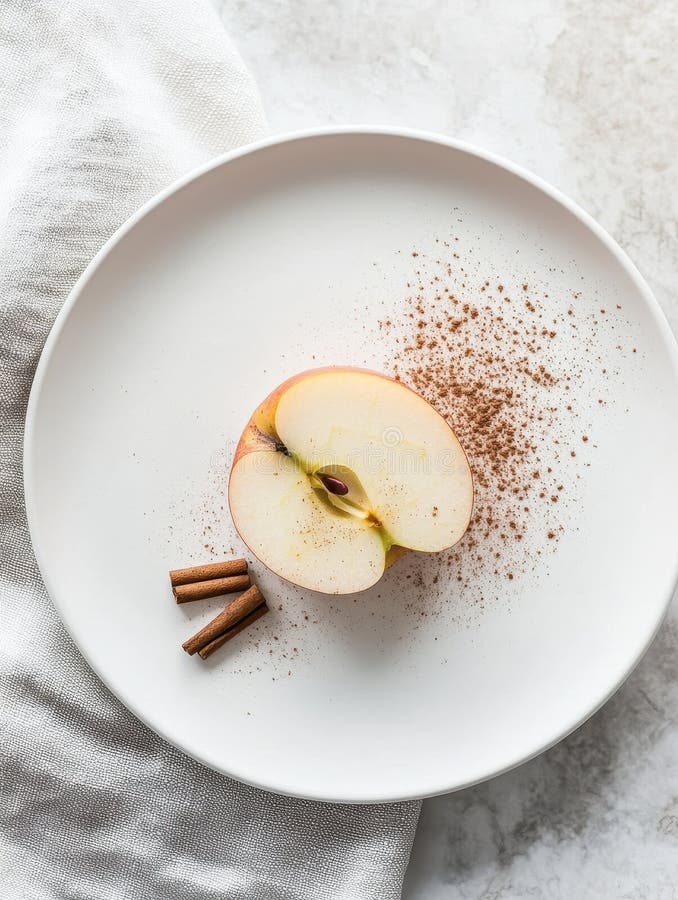 A Sliced Apple on a Plate with Cinnamon and Spice, Styled for a Food ...