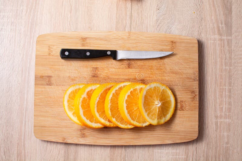Sliced Mandarin on the Wooden Cutting Table Stock Photo - Image of ...