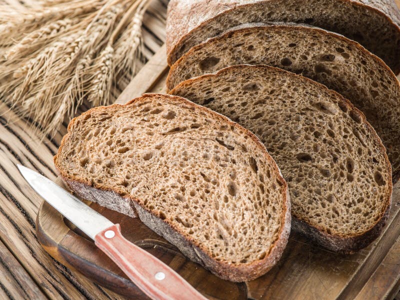 Sliced Black Bread on the Wooden Plank. Stock Photo - Image of pastry ...