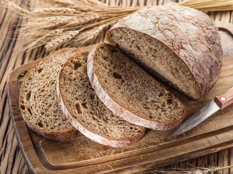 Sliced Black Bread on the Wooden Plank. Stock Photo - Image of baked ...