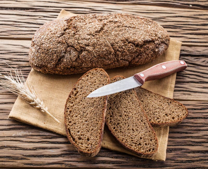 Sliced Black Bread on the Wooden Plank. Stock Photo - Image of bakery ...
