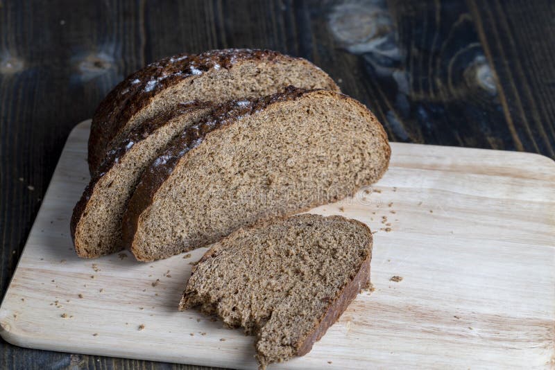 Sliced Black Rye Bread on a Board Stock Image - Image of meal, homemade ...