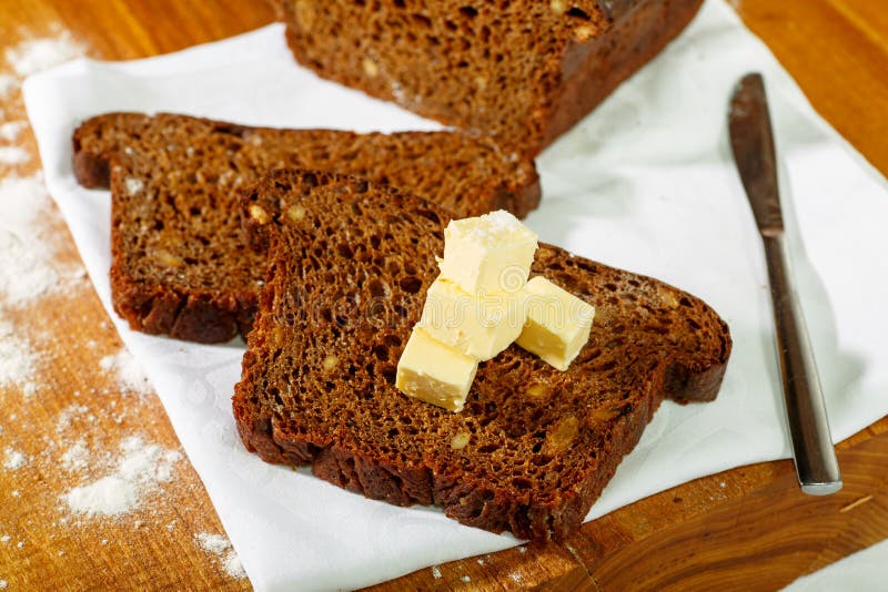 And Sliced Bread in One Piece a Bit of Butter Lying on Woo Stock Image ...