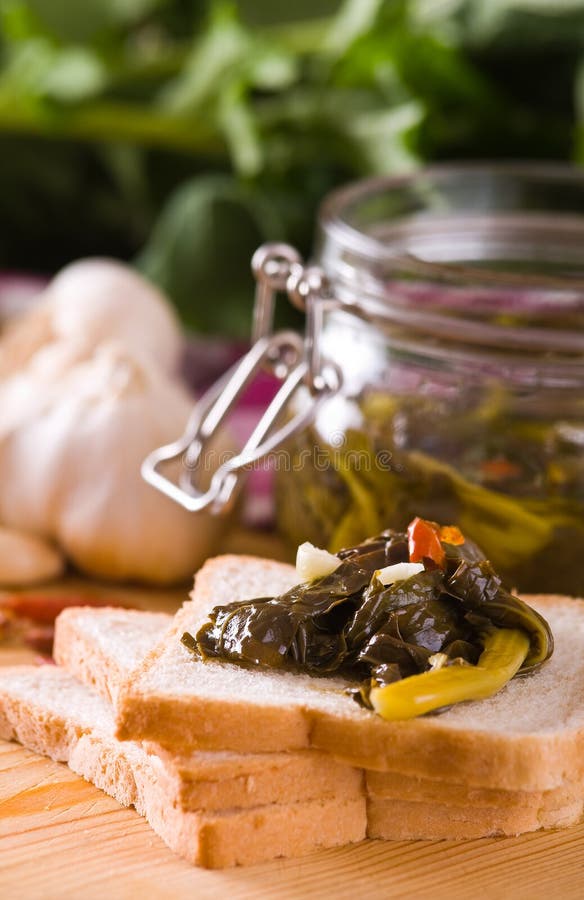 Sliced Bread with Turnip Tops Under Oil. Stock Photo - Image of board ...