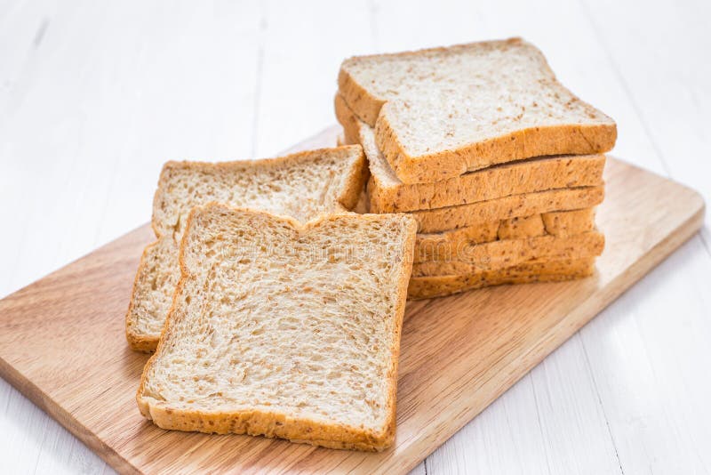 Sliced Bread on White Wooden Table Stock Image - Image of appetizing ...