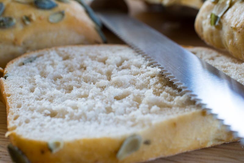 Sliced Bun and Knife Blade Closeup. Stock Image - Image of bakery ...